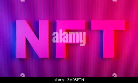 NFT non-fungible token on a bright pink neon background. NFT ...