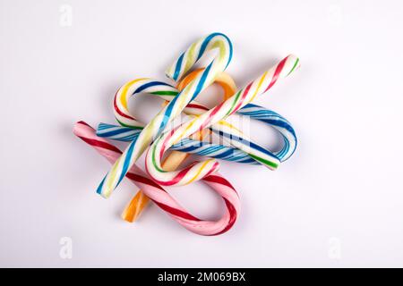Different colored candy canes on a dark chalkboard background Stock ...