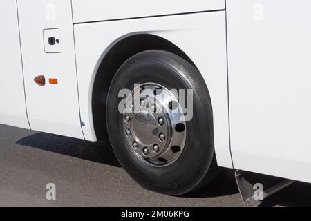 Huge bus wheel with a shiny disc. White bus wheel arch. Michelin tire ...