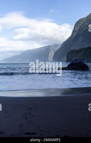 black sand beach of Madeira view on mountains Stock Photo - Alamy