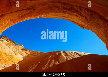 Hiker in the Great Chamber grotto, Utah, USA. Travel and journey scene ...