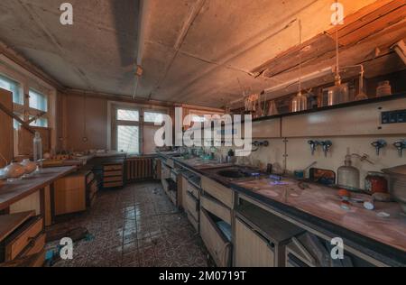 Old abandoned chemical laboratory. Long table with broken flasks Stock ...