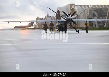 GUAM (May 12, 2022) -- From left, Capt. Steven Wasson; Capt. John Bub ...