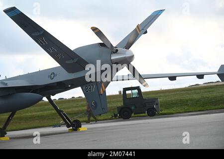 GUAM (May 12, 2022) -- From left, Capt. Steven Wasson; Capt. John Bub ...