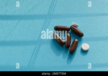 Vitamins and doctor's mask, crown virus protection concept on blue ...