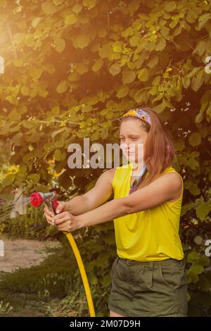 Joyful beautiful blonde female pouring lotion or cream on hand after ...