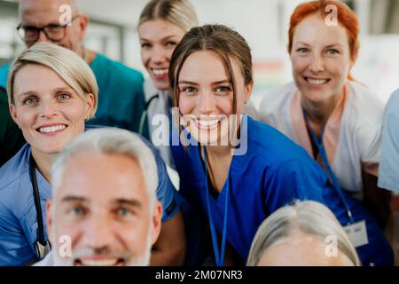 Portrait of happy doctors, nurses and other medical staff in hospital ...