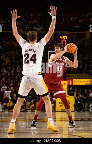 Stanford forward Maxime Raynaud (42) and teammates walk to the bench ...