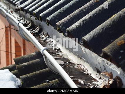 Rain water from roof gutter discharging into surface water drainage ...