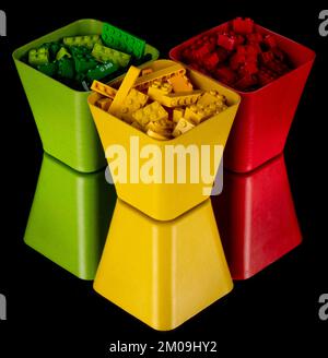 Red bucket full of red Lego blocks on a reflective surface Stock Photo ...