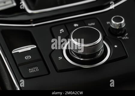 Car media controller close up. Modern car media and navigation control ...