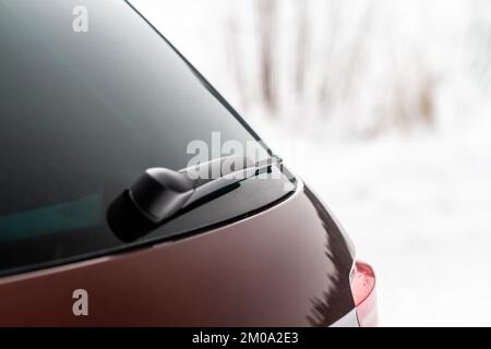 Car rear window. A car wiper cleans the rear window Stock Photo - Alamy
