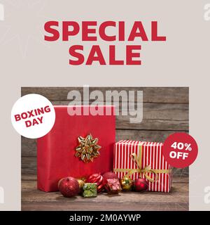 Composition of boxing day text over christmas decorations on red ...