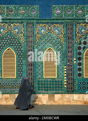 Two women in white burqas (burkas) at the Shrine of Khwaja Abu Nasr ...