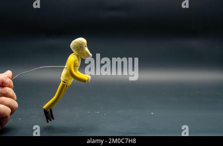 Stopmotion process of jumping. Jumping. Man's hand holding with an ...