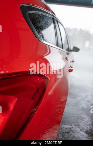 Side of a red car being washed Stock Photo - Alamy