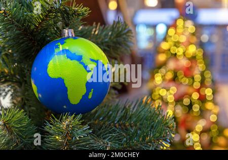 Globe-shaped Christmas ball with countries and continents on the ...