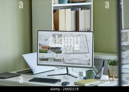 Close up of computer with 3D blueprints on screen, architects workplace ...