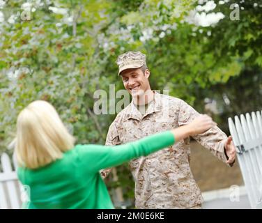 Wife Hugging Army Husband Home On Leave Stock Photo - Alamy