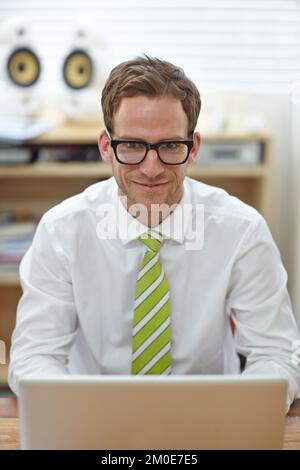 Young man watching stock market on laptop Stock Photo - Alamy