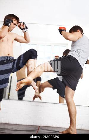 Two men training in sparring at karate training in gym Stock Photo - Alamy