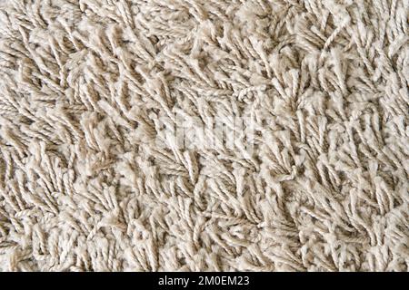 The texture of a soft, fleecy, light-colored floor rug Stock Photo - Alamy