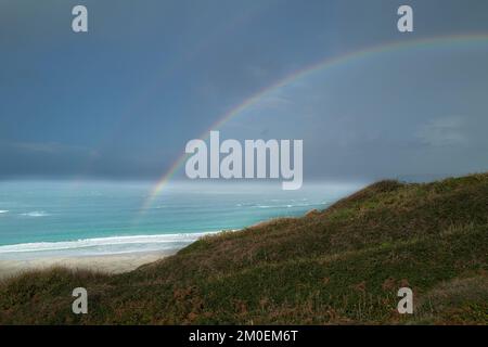 Rainbow over Sennen Cove (Whitesand Bay), Cornwall, England, after a ...