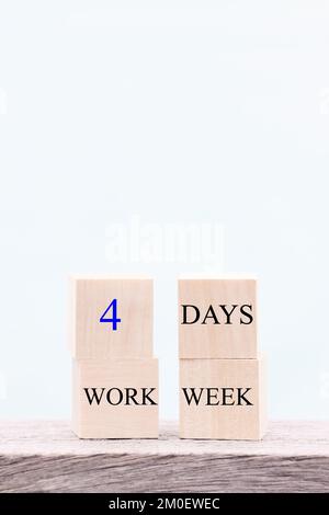 Four-day working week symbol. Concept words Four-day working week on books on a beautiful white ...