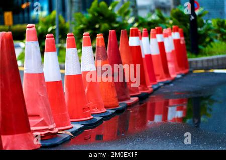A number of red traffic cones, limiting the passage Stock Photo - Alamy