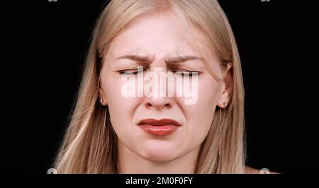 Headshot of young crying woman experiencing grief or loss. Grimace of ...