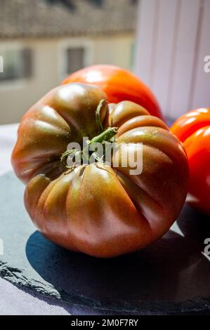 Fresh ripe colorful french tomatoes vegetables from Provence in wooden ...