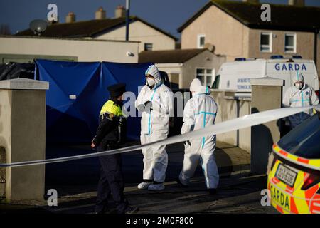 Forensic officers at the scene in Ronanstown, Dublin, where a man was ...