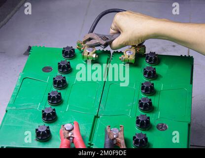 electrician connecting battery terminals Stock Photo - Alamy