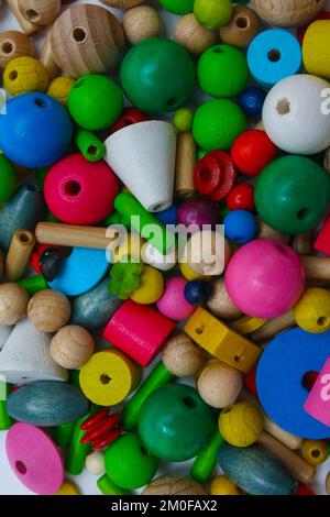 Different colorful beads on green background Stock Photo - Alamy