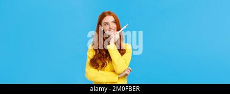 Creative and inspired cute excited redhead woman, journalist or writer ...