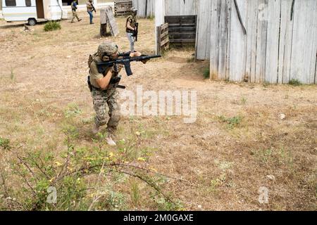 Airsoft player in offensive tactical position advances to take ...