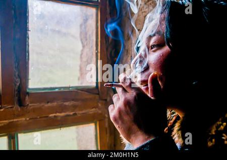Monk smoking in a monastery, Kailash Kora, Western Tibet, Asia Stock ...