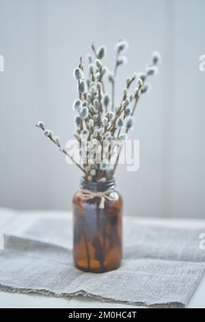 Vase with blossoming branches in interior of stylish room Stock Photo ...
