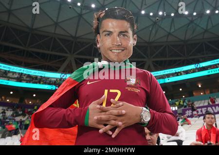 A Portugal fan in the stands wearing a Cristiano Ronaldo mask before ...