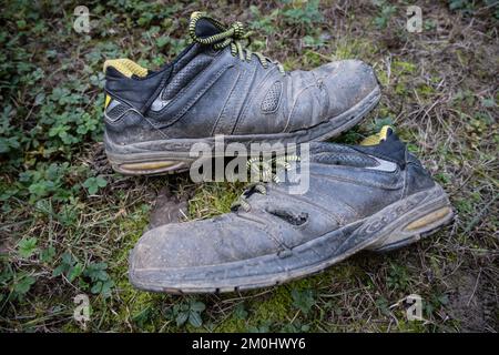 Old safety work shoes worn out by hard work in the fields Stock Photo ...