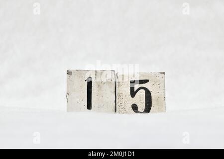 White wooden number fifteen 15 on blue background Stock Photo - Alamy