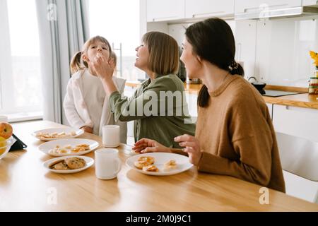 White family having breakfast while spending time together at home ...