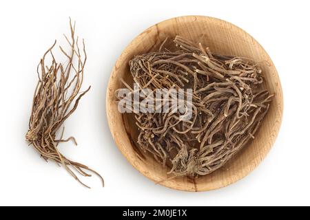 Dried Valerian root in wooden bowl isolated on white background ...