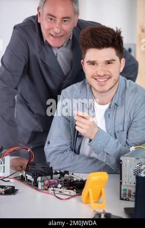 Student in electrical engineering course training with teacher Stock ...