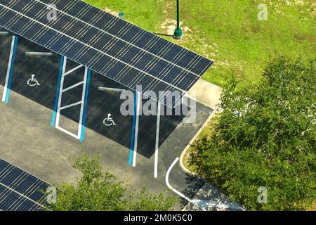 Solar panels installed as shade roof over parking lot for parked electric cars for effective ...