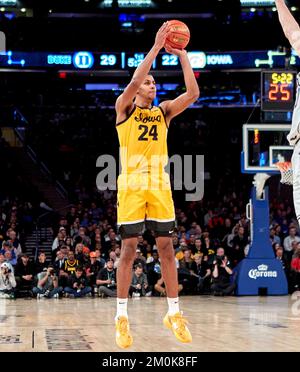 Iowa forward Kris Murray (24) shoots a 3-point basket ahead of Indiana ...