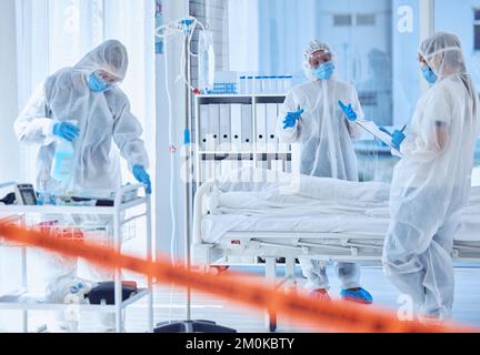 Biohazard team moving a dead body in a hospital bed. Team of doctors ...
