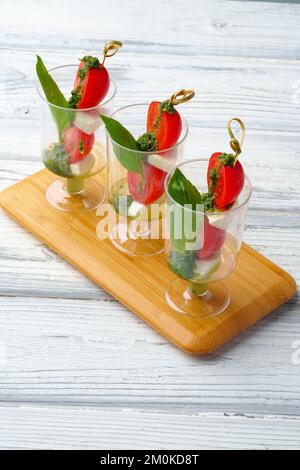 Caprese canapes in glasses on a skewer Stock Photo - Alamy