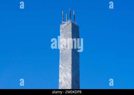 Unfinished concrete column under tower construction with protruded ...