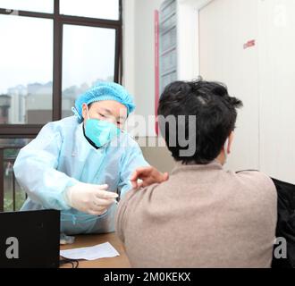 CHONGQING, CHINA - DECEMBER 19, 2022 - A medical worker inoculates a ...